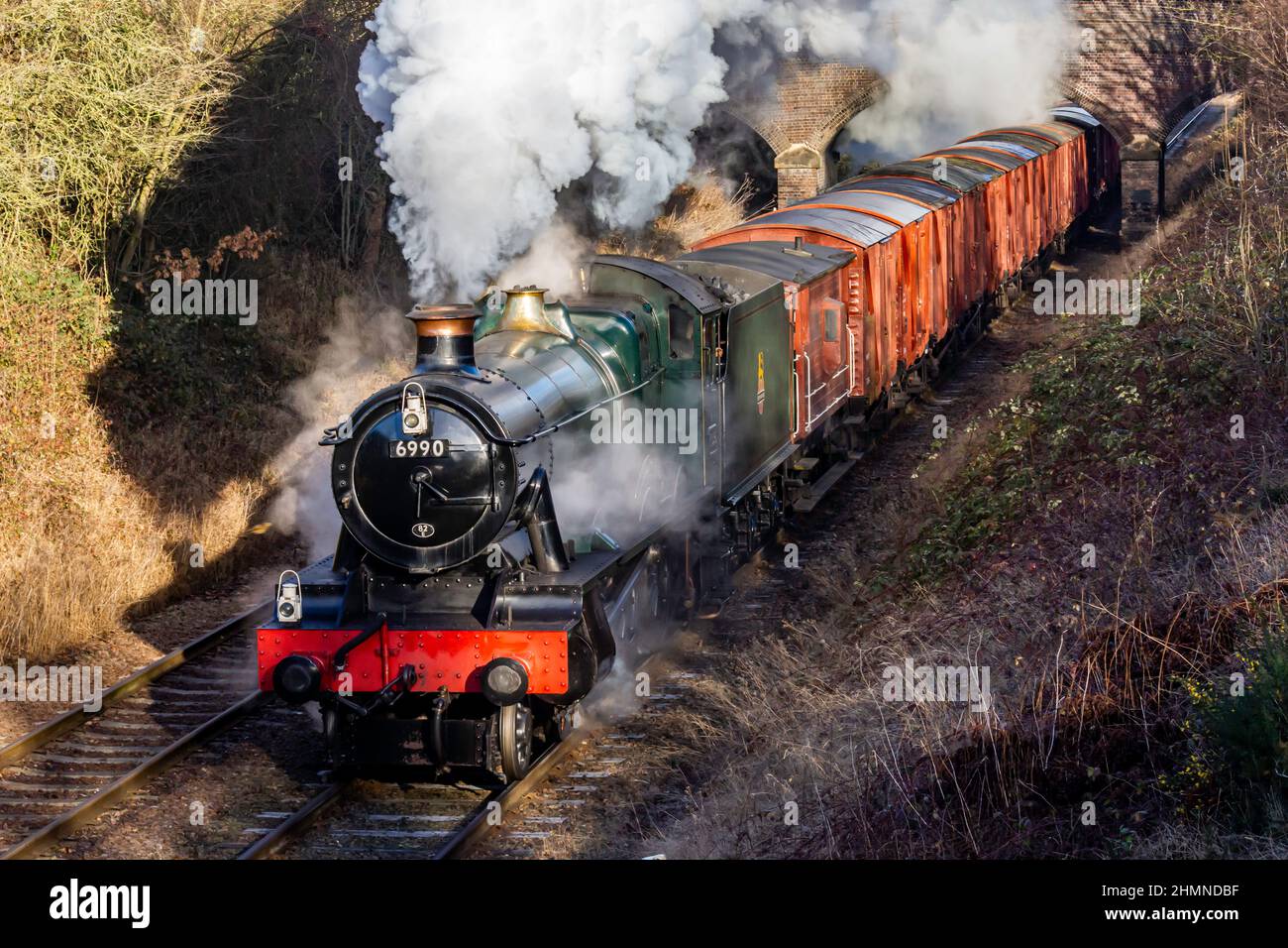 GWR locomotive 6990 Witherslack Hall with a goods train heading south ...