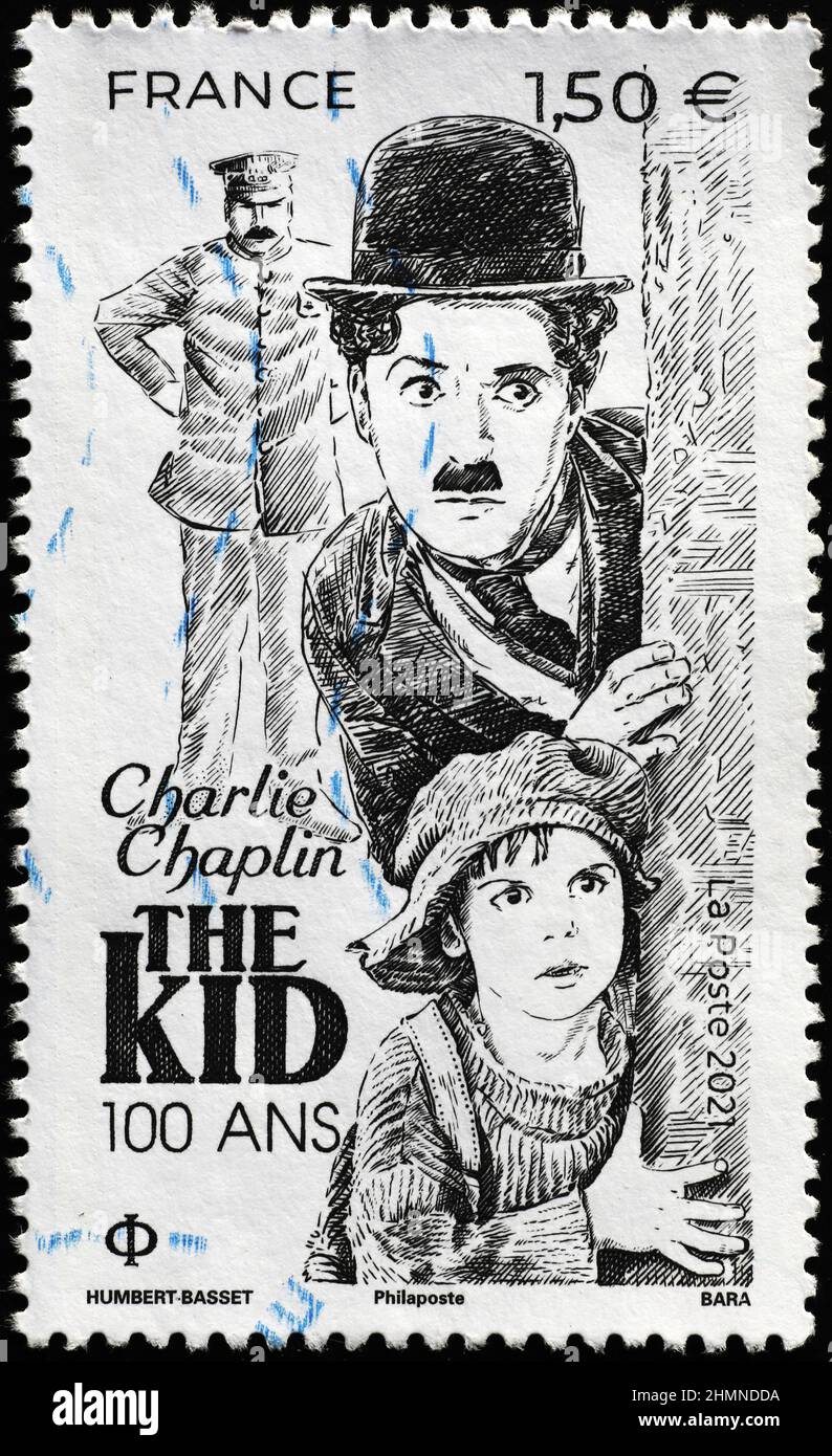 Charlie Chaplin's movie the kid celebrated on stamp Stock Photo - Alamy