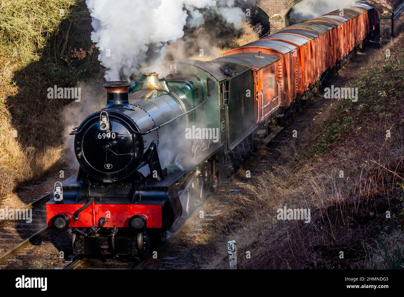 GWR locomotive 6990 Witherslack Hall with a goods train heading south ...