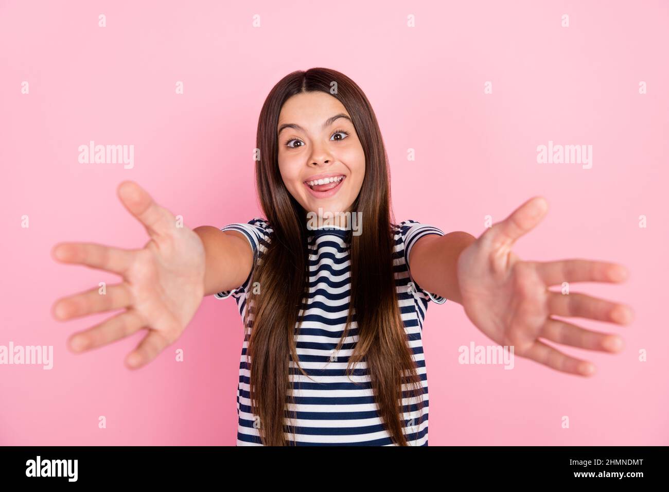 Photo of cute friendly girl dressed striped clothes open arm ready hug ...