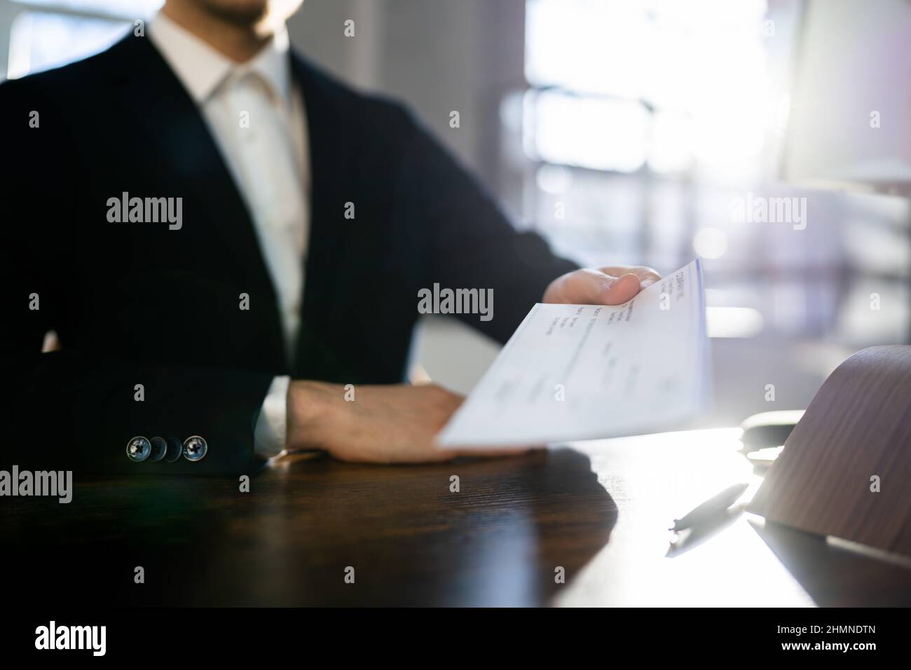 Giving Paycheck Or Payroll Cheque. Rent Check Pay Stock Photo - Alamy