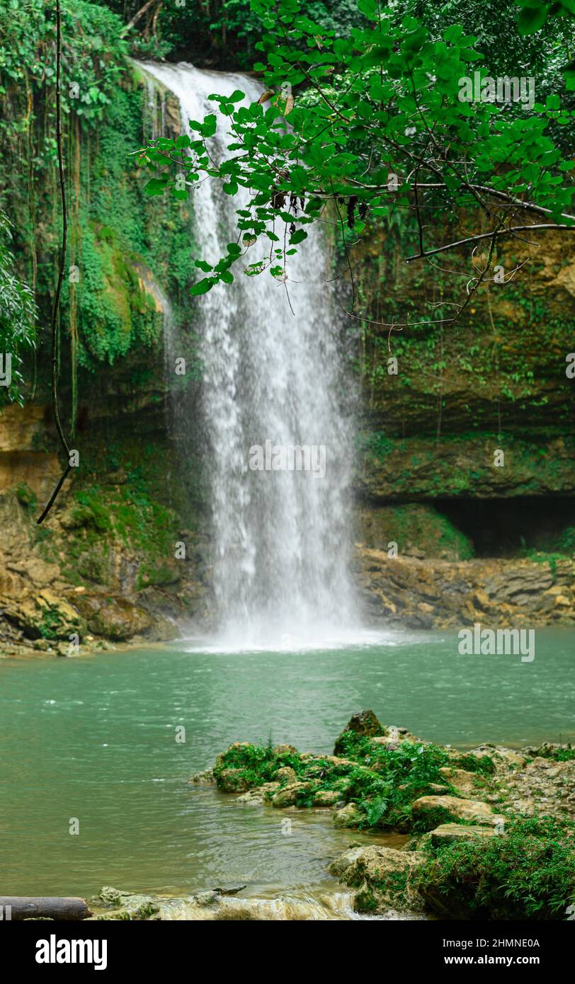 The photo shows a huge waterfall. Below is a perfectly clear water ...