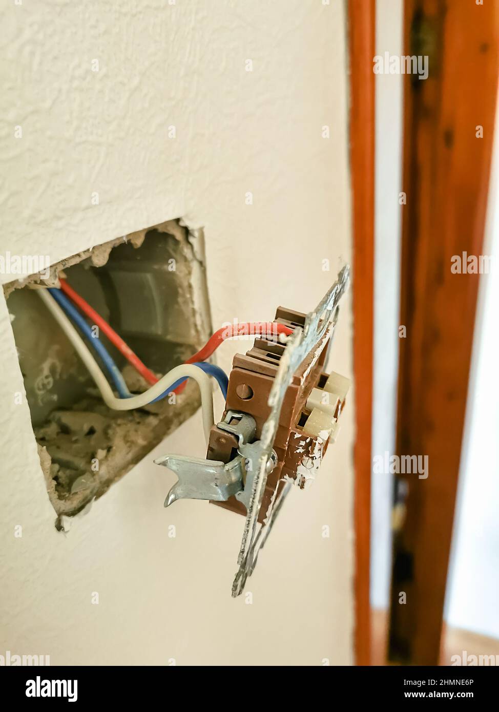 Electric socket with wires. Electrical wiring repair concept. Vertical ...