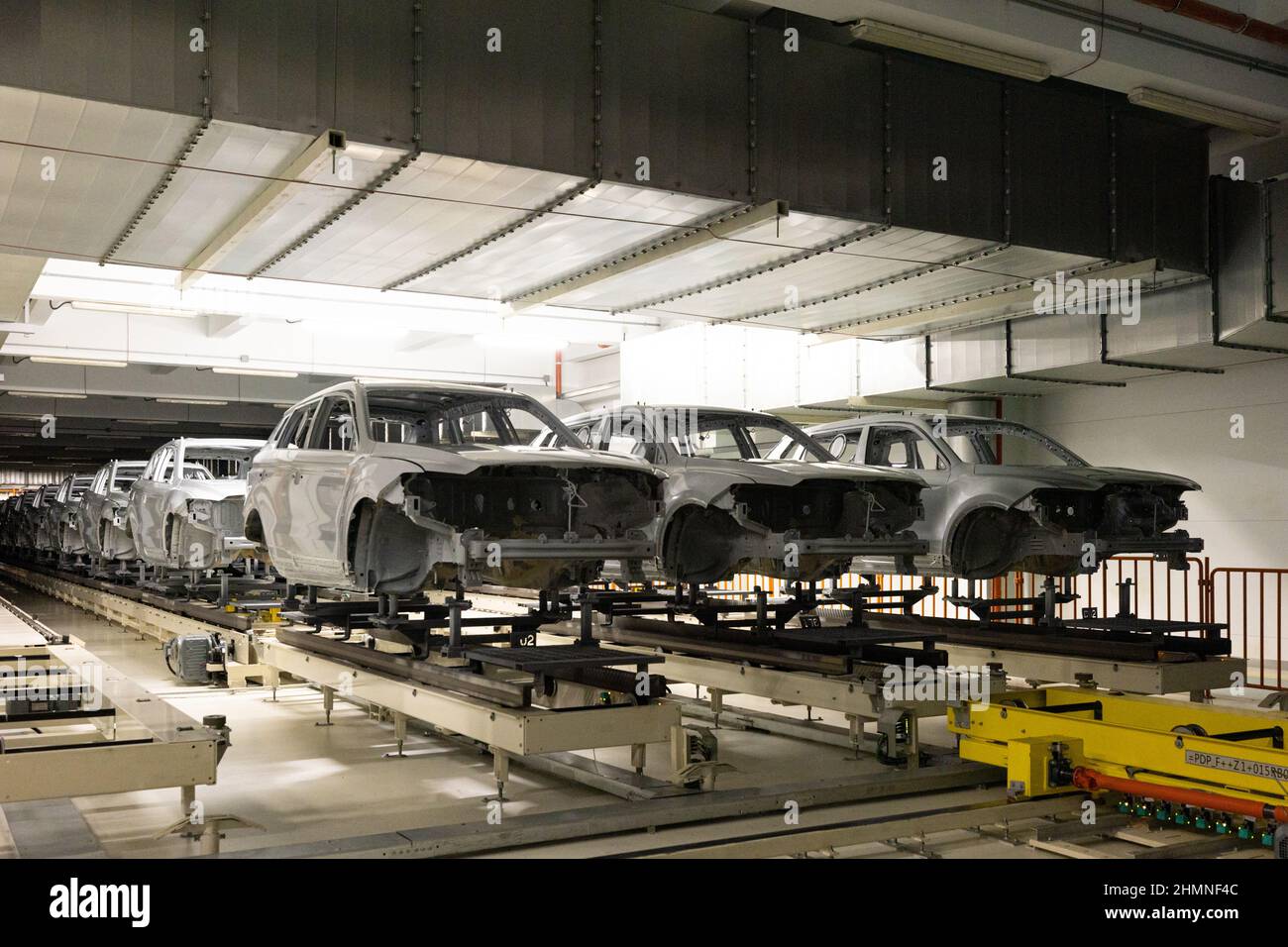 Car bodies are on assembly line. Modern automotive industry. Automobile ...