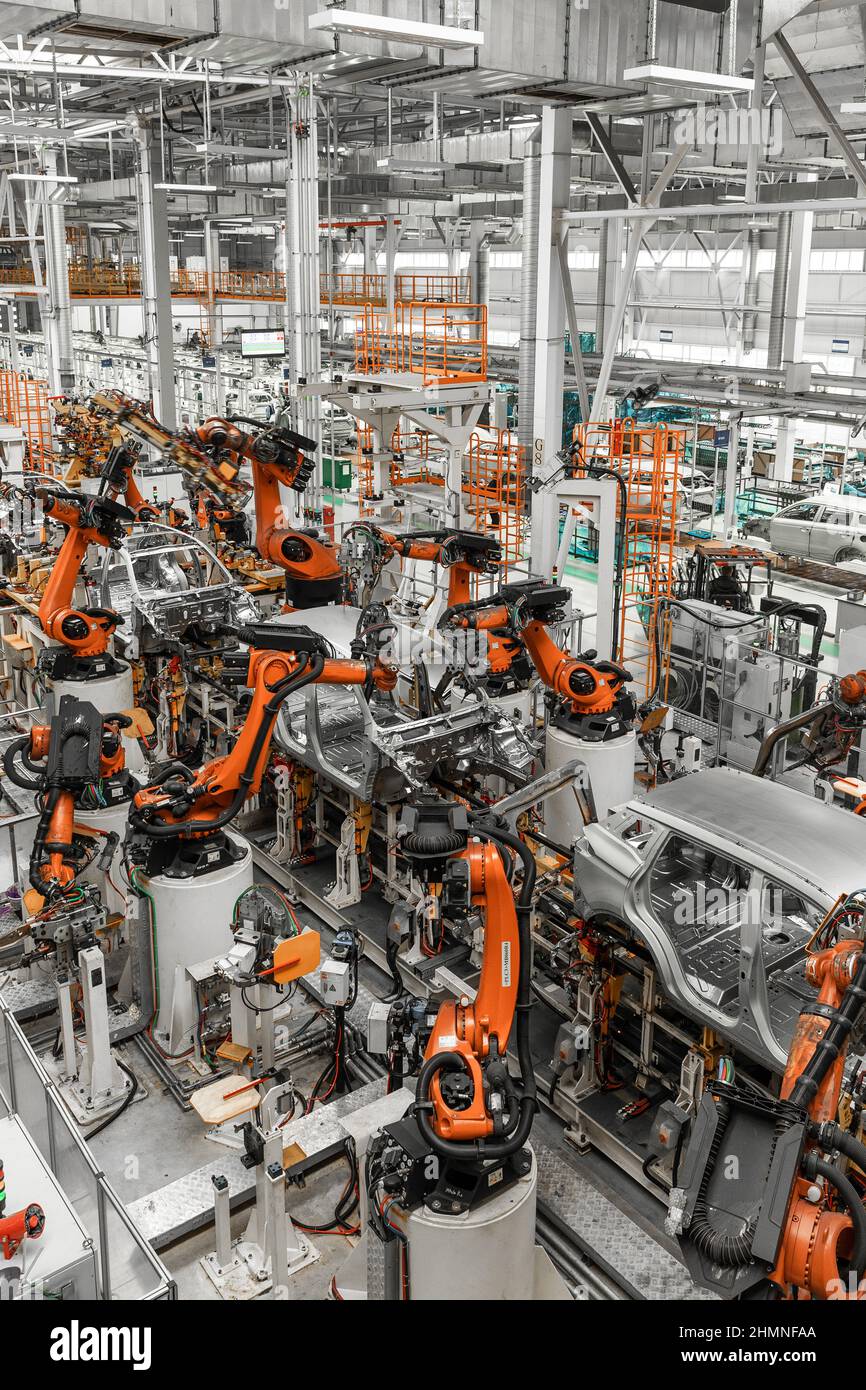 Vertical photo of automobile production line. Modern car assembly plant ...