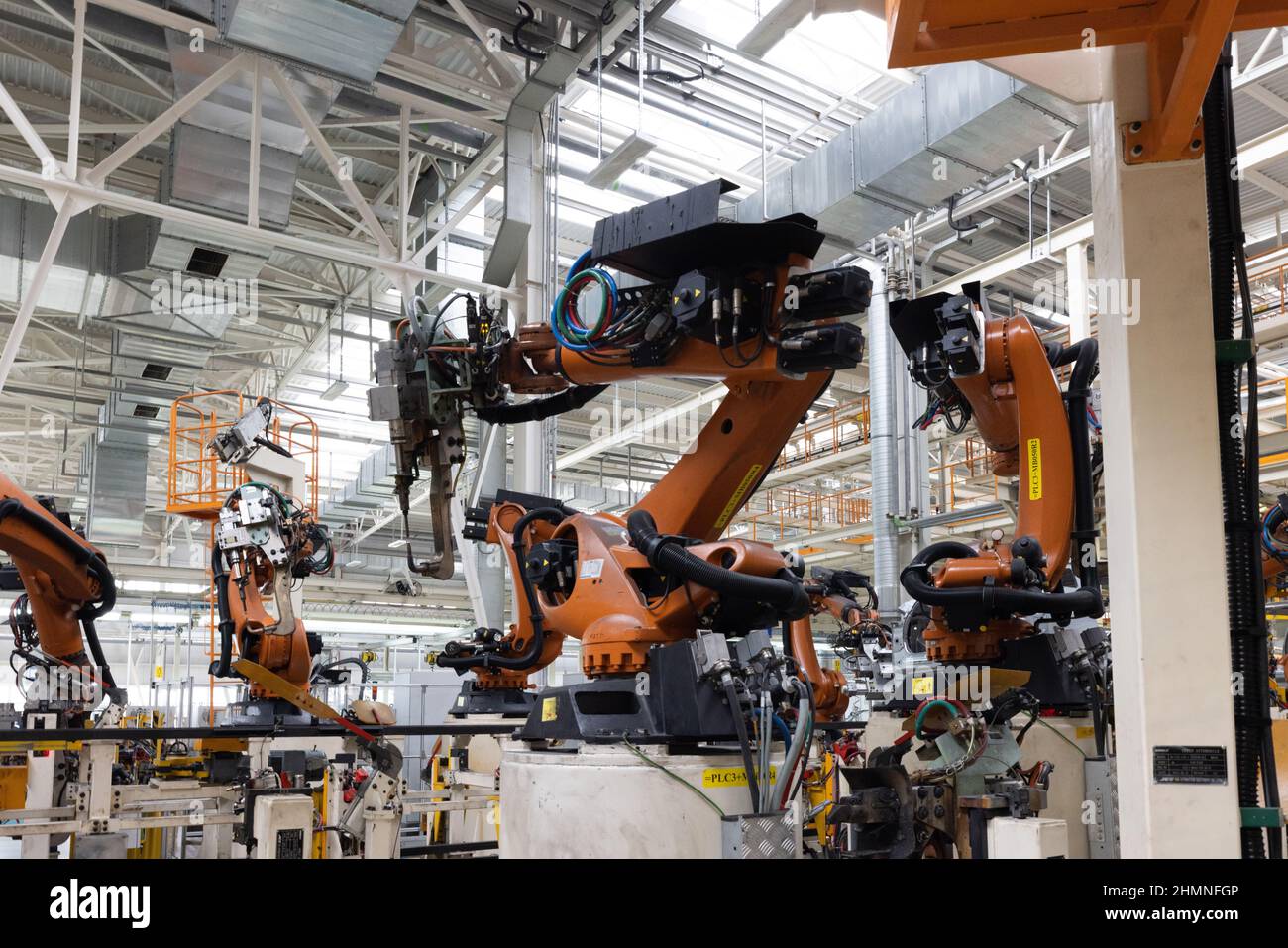 Photo of automobile production line. Welding car body. Modern car ...