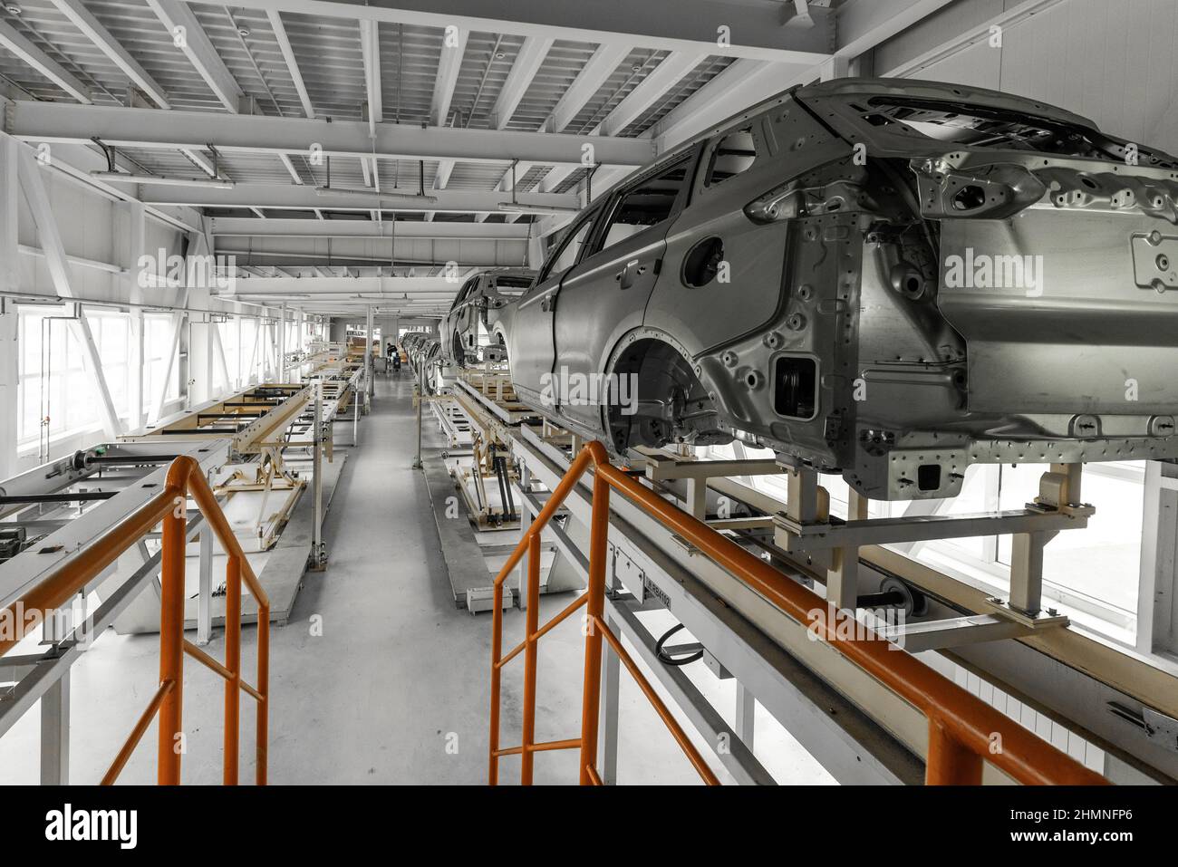 Car bodies are on assembly line. Factory for production of cars. Modern ...