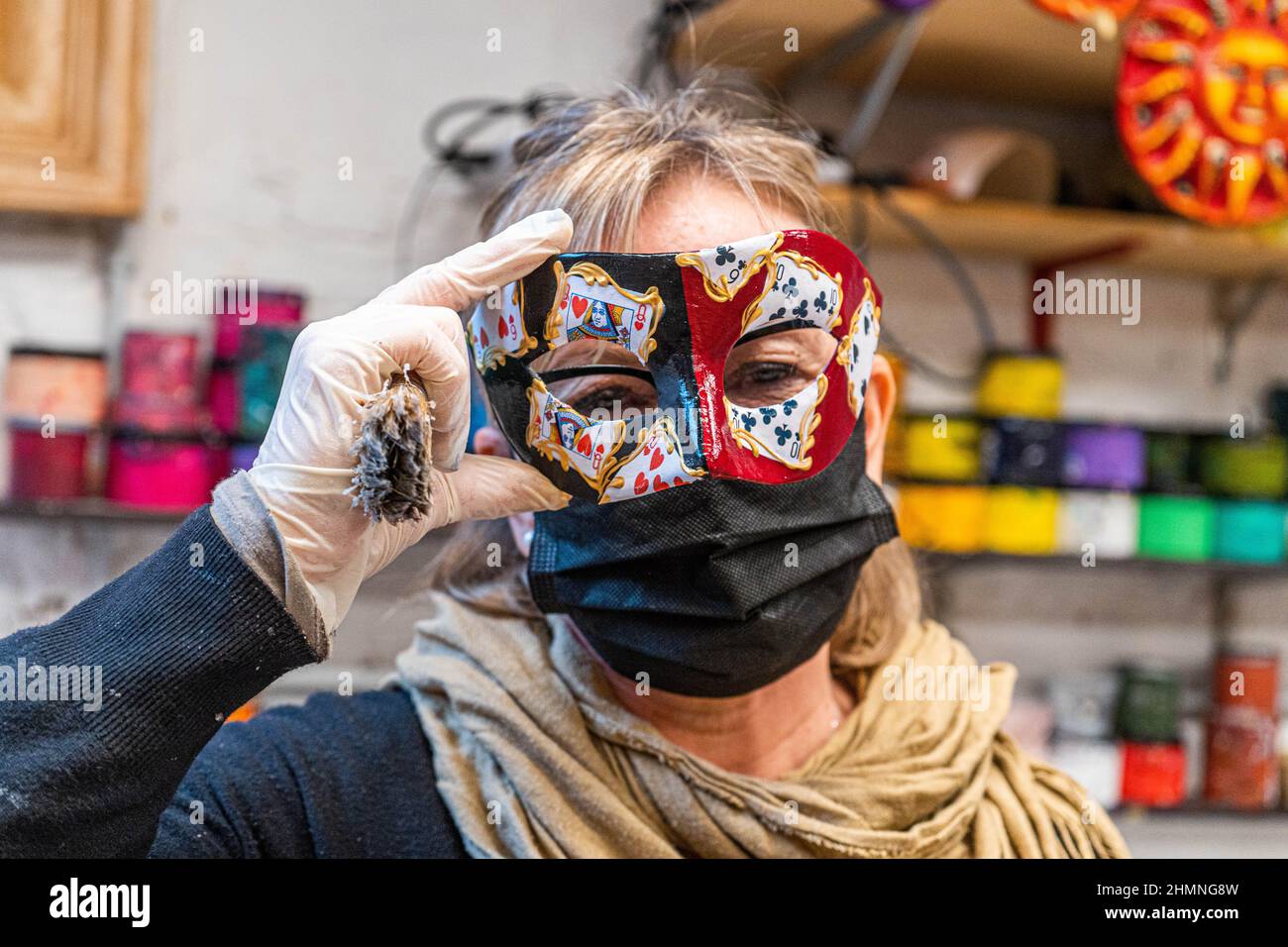 Venice, Italy. 11th Feb, 2022. Handcraft artist Fiorella wears a ...