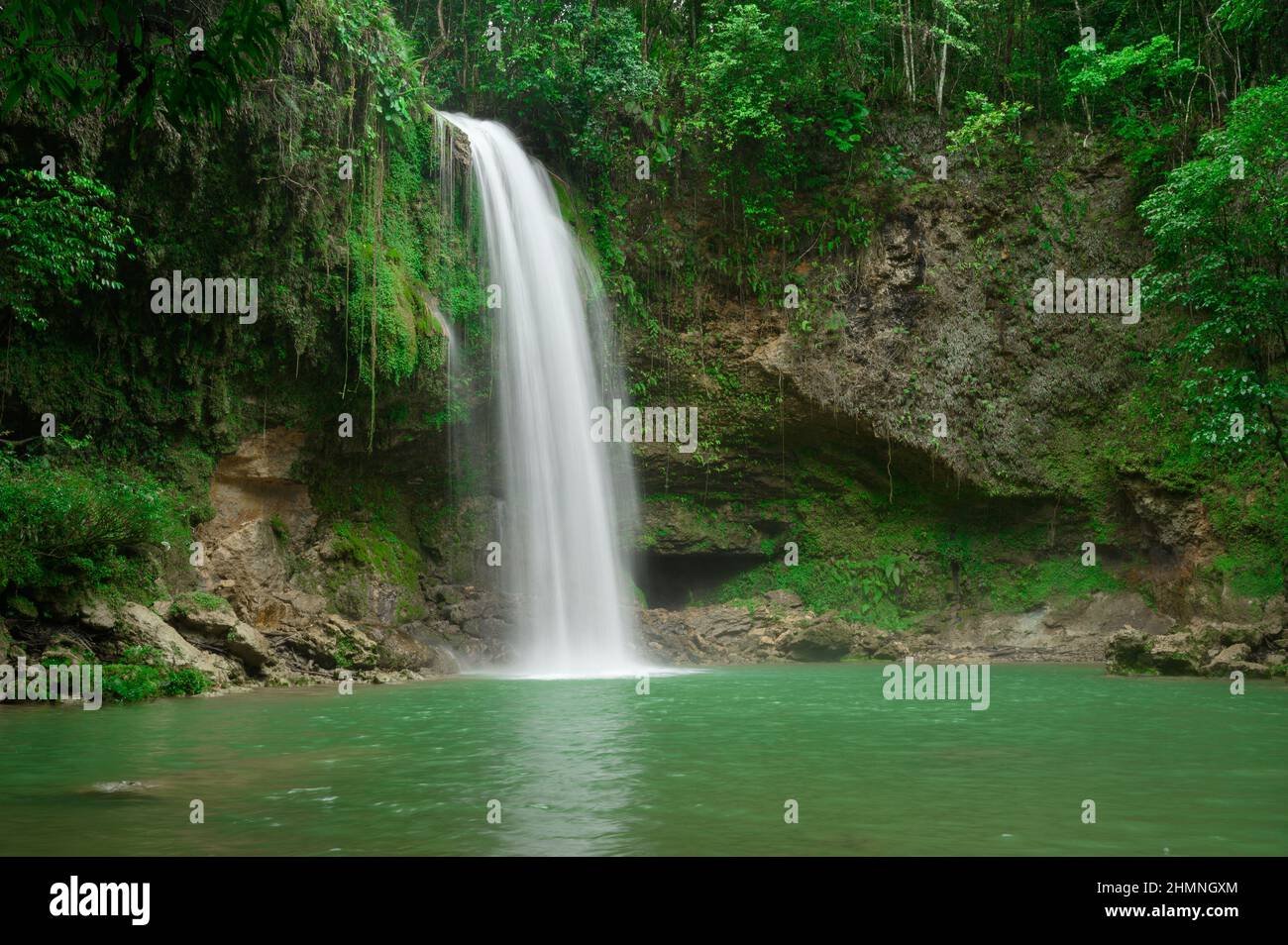 Photo shows huge clean water fall. Below is perfectly clear water ...