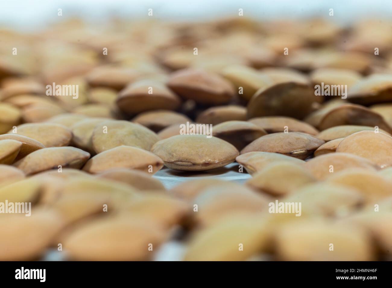 Isolated stack of uncooked lentils on white background - Dry beans ...