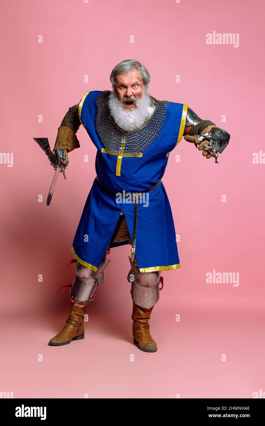 Portrait of senior grey bearded man, brave medieval warrior or knight ...