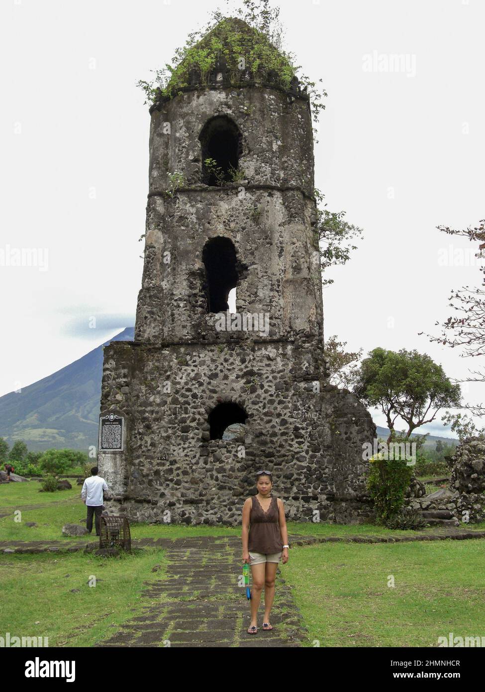 Historic old bell tower in front of the mount Mayon at the Cagsawa ...