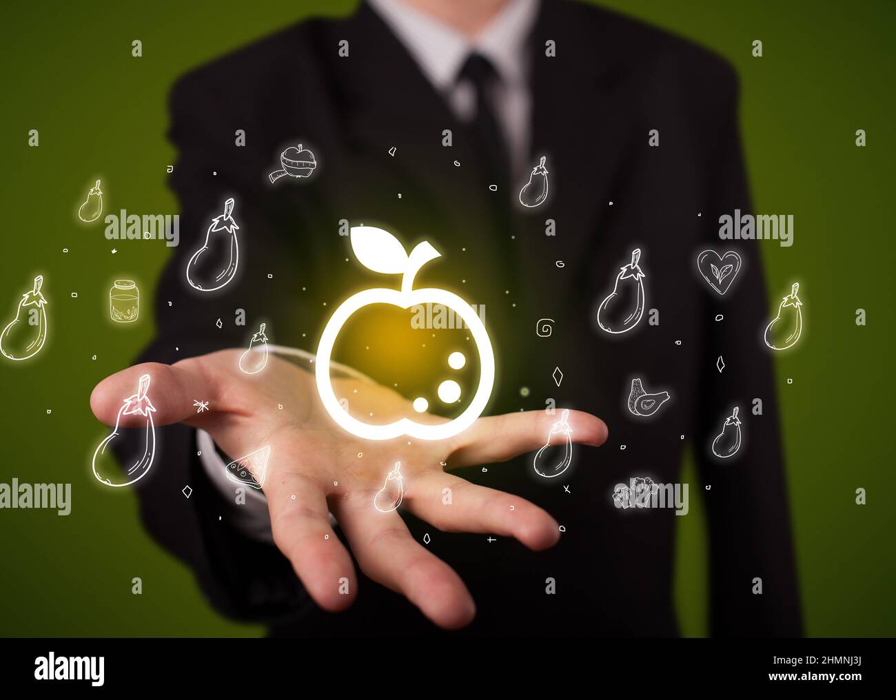 Hand holding food related icons Stock Photo - Alamy
