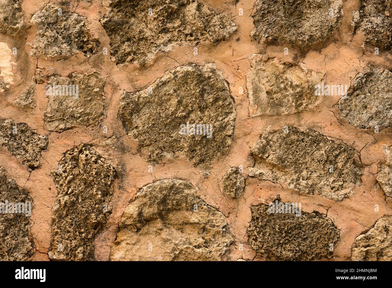 The photo shows a stone wall, delimitation of the natural stone of ...