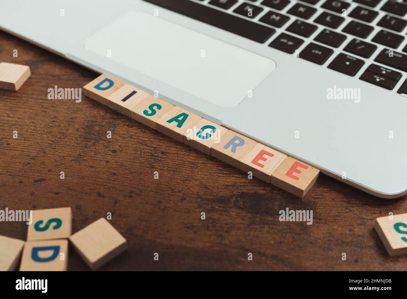 Disagree word written on wooden letter cubes tiles - computer desk and ...
