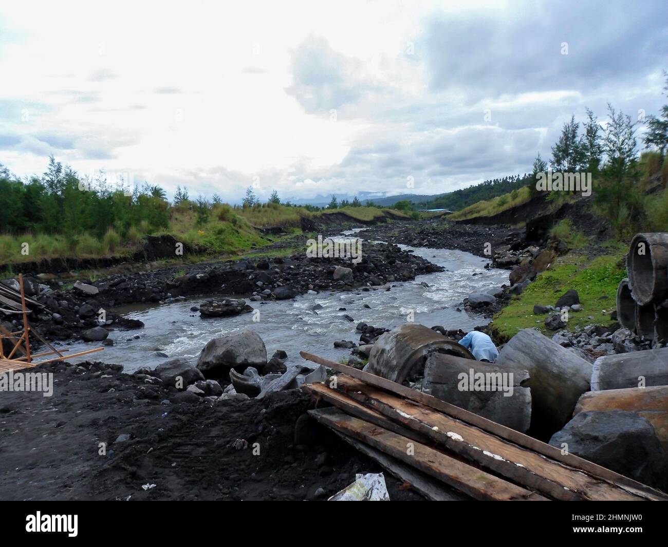 Little river flows in Cagsawa on the Philippines January 18, 2012 Stock ...