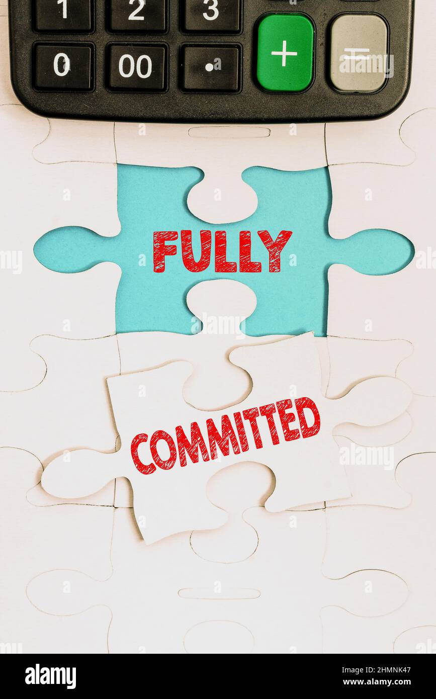 Hand writing sign Fully Committed. Word Written on Extremely agreed to ...