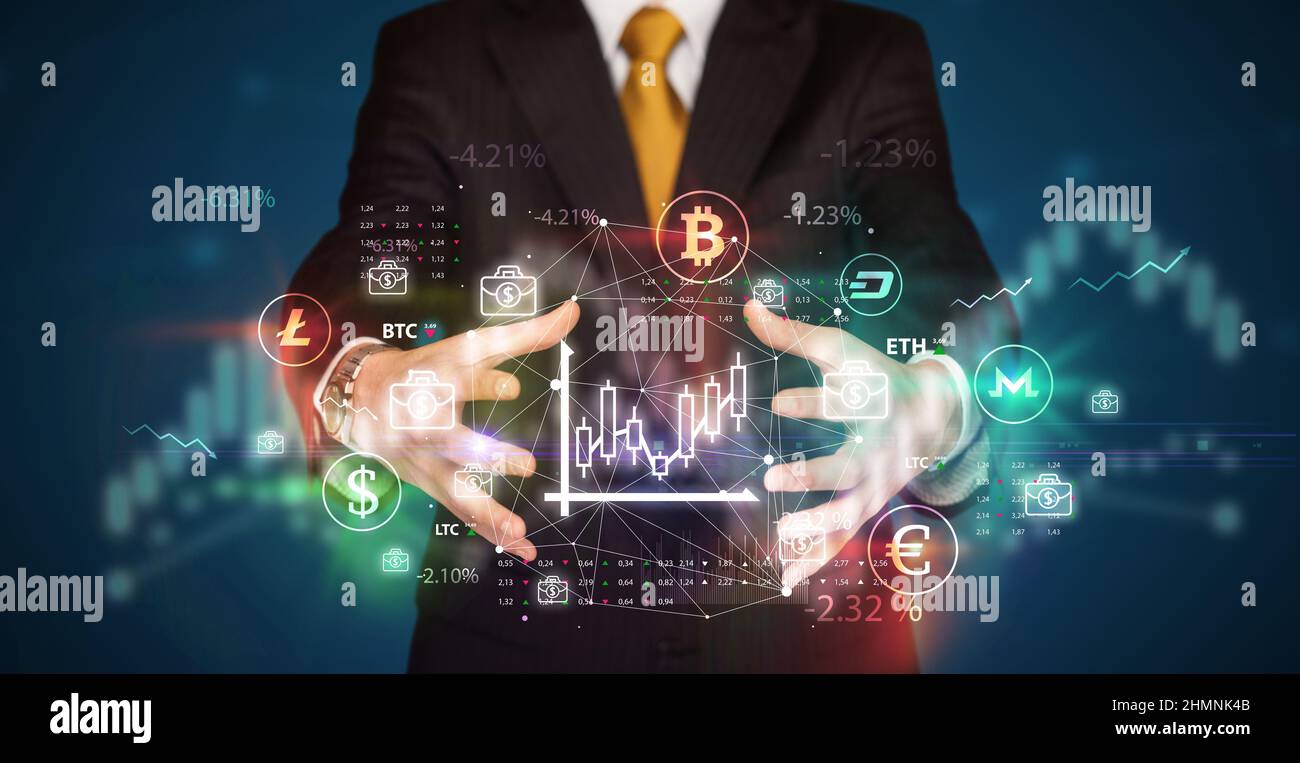 Businessman holding currency symbols Stock Photo - Alamy