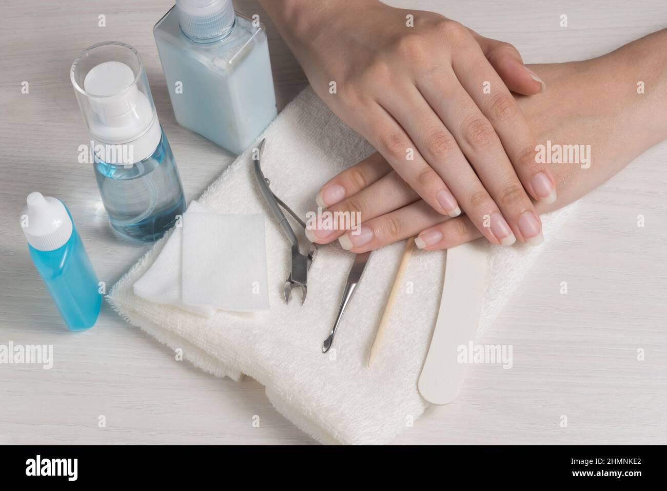 Women's hands on a towel. Manicure. Manicure tools, nail Polish. Home ...