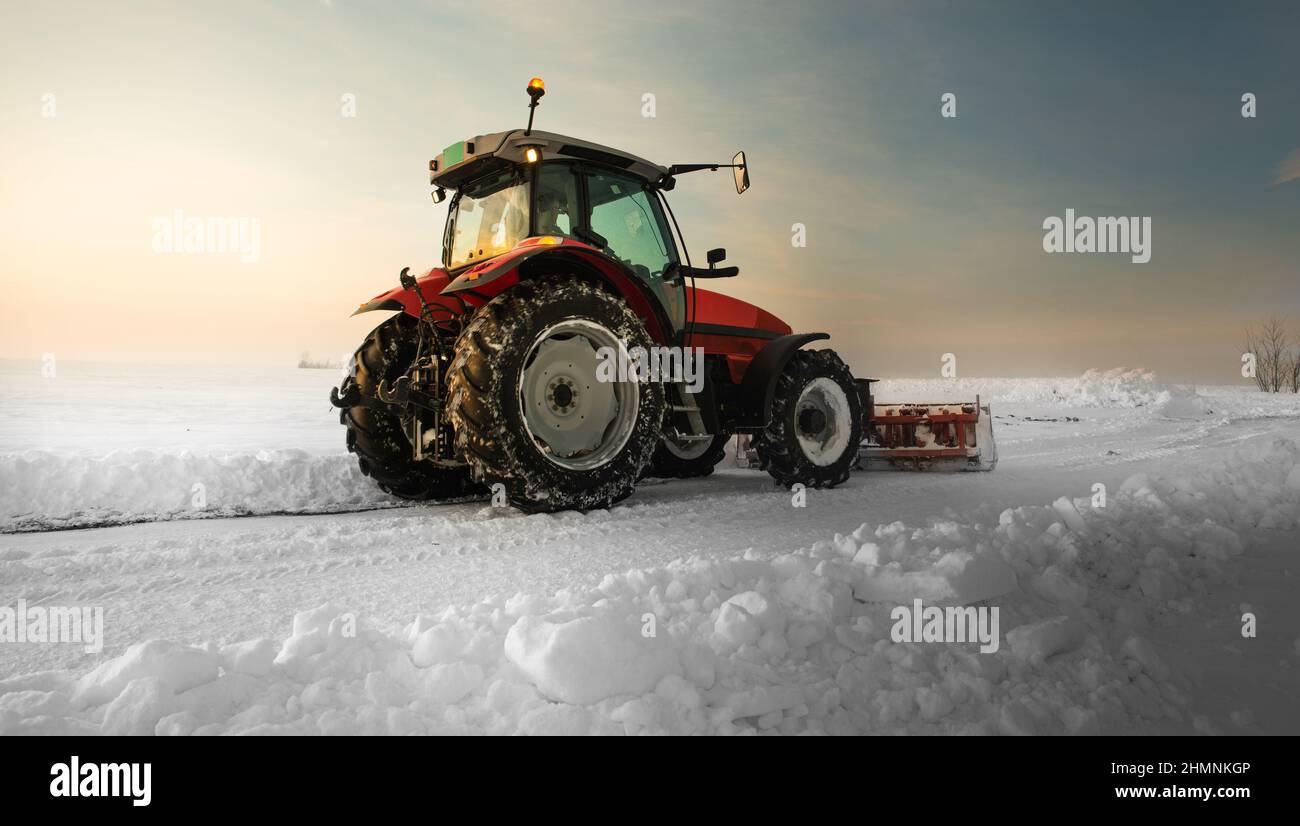 Big tractor cleans road hi-res stock photography and images - Alamy