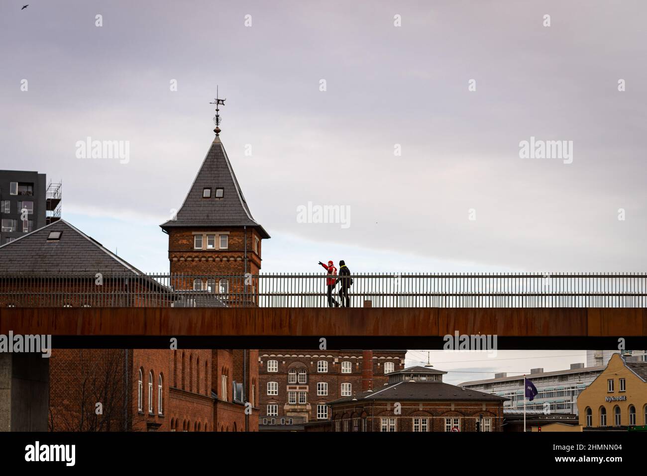 Denmark two people cross a busy road over a bridge Stock Photo - Alamy