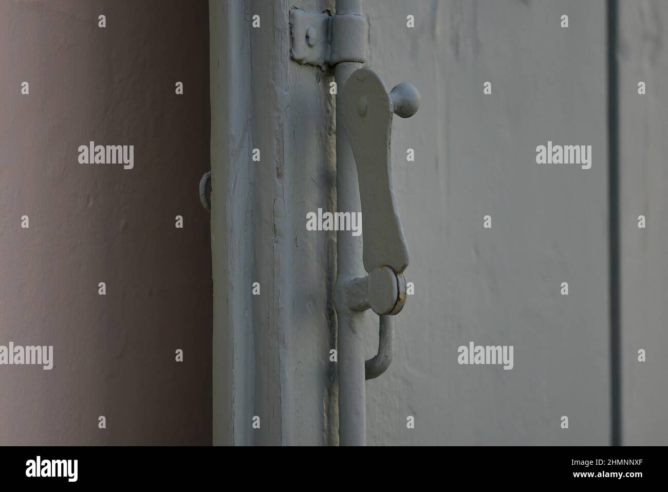 Old rural house light grey wooden window shutter with a matching metal ...