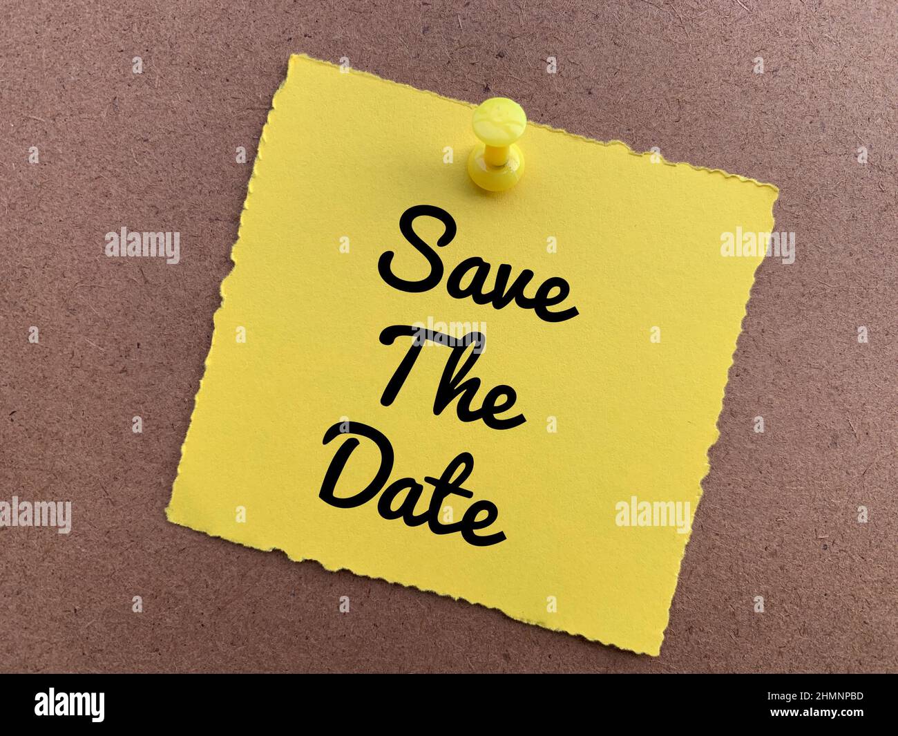 Save the date text on yellow torn notepad Stock Photo - Alamy