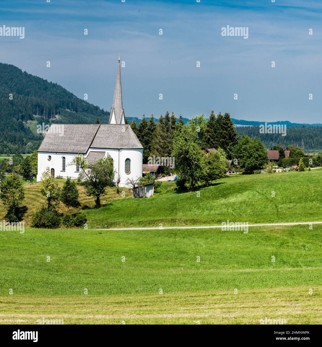 Scenic view of a chapel and green hills over the German countryside in ...