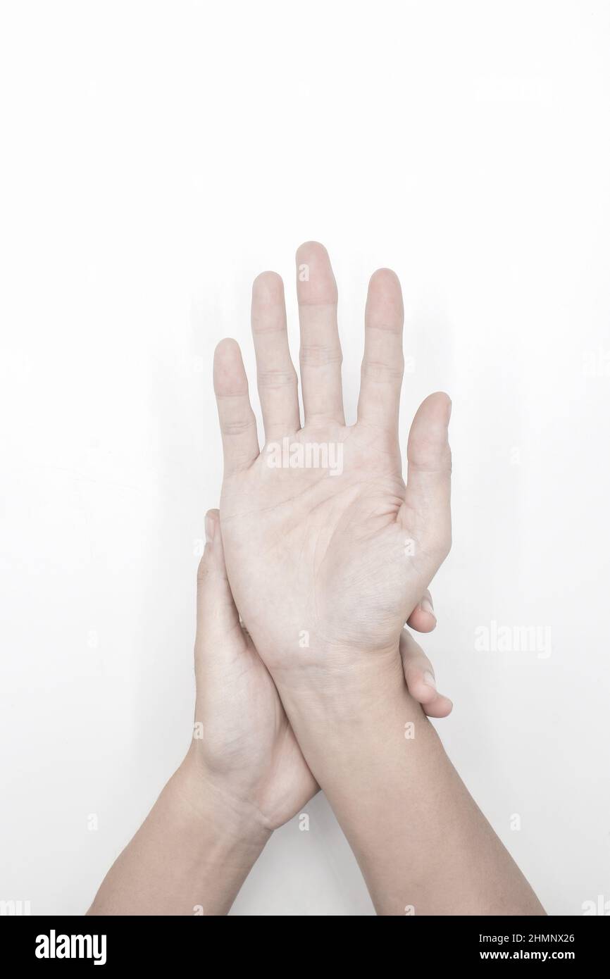 Pale palmar surface of both hands. Anaemic hands of Asian, Chinese man ...