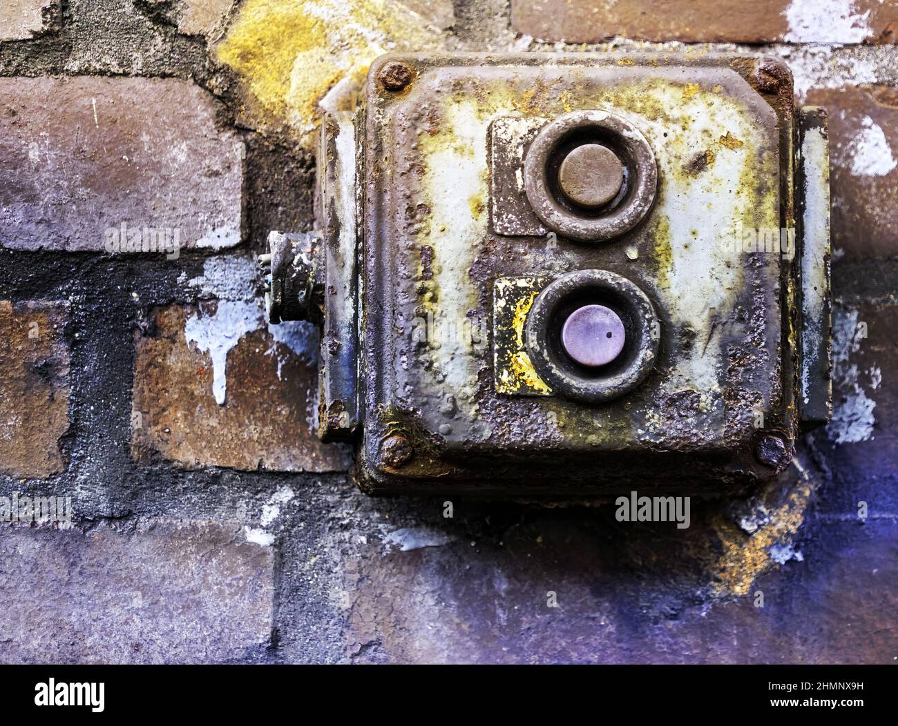 Defective old power switch in a fuse box made of rotten plastic on a ...