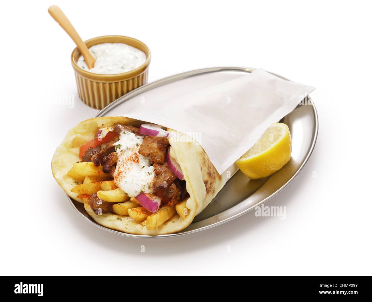 homemade pork meat gyros(pita wrap sandwich) with tzatziki(yogurt sauce ...