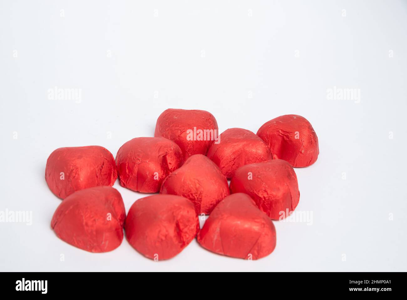 Chocolate red heart sweets for Valentine's Day on a white background ...