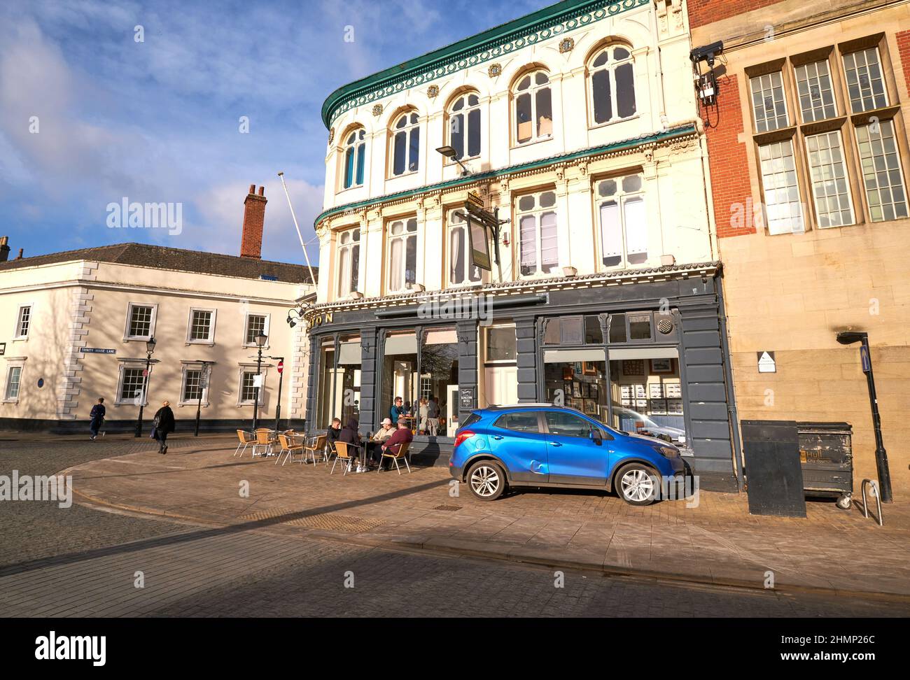 Group of men sitting outside a pub Stock Photo - Alamy