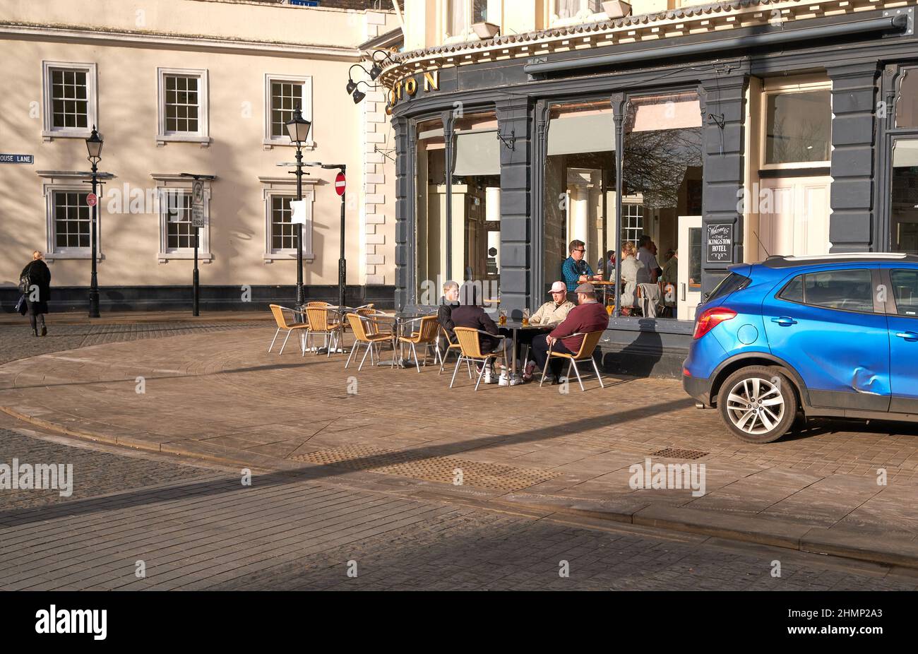 Group of men sitting outside a pub Stock Photo - Alamy