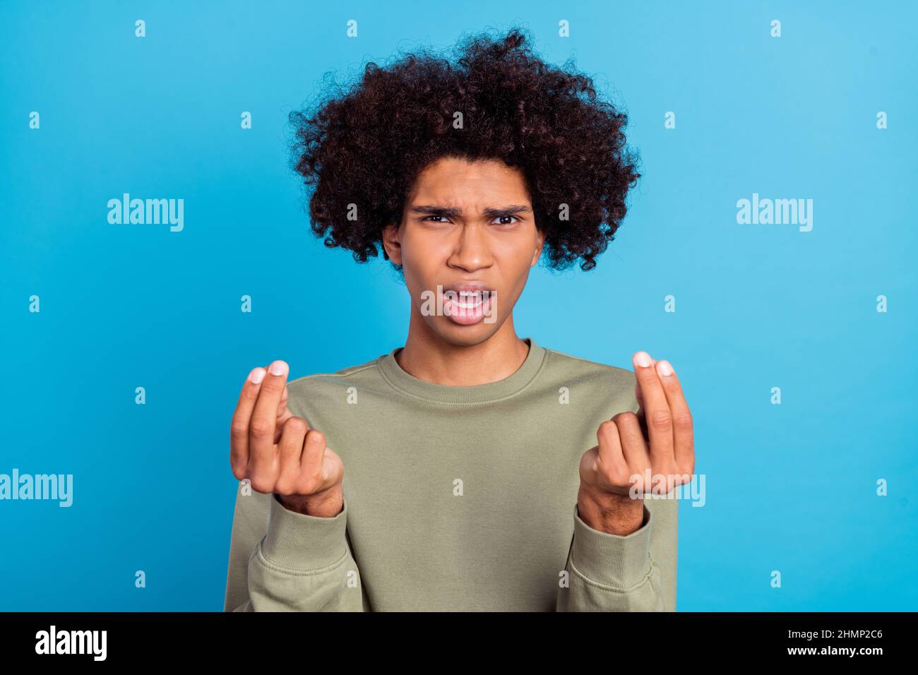 Photo of young guy show fingers ask money quarrel conflict angry mad ...