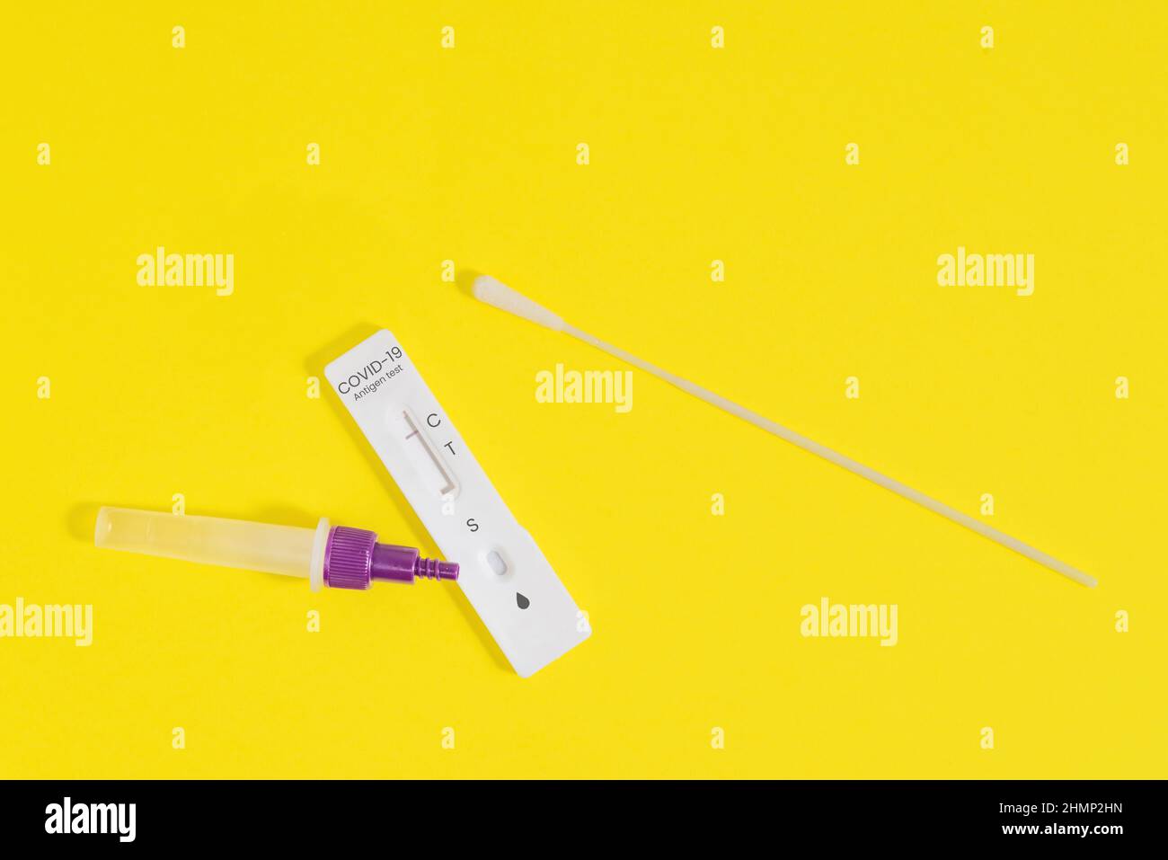 Antigen swab and dropper test on yellow background to detect covid-19 ...