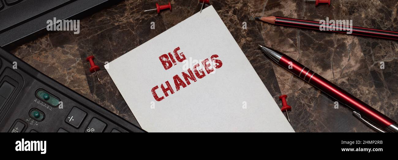 Big changes. Text on a white sheet lying on the office table. Economic ...