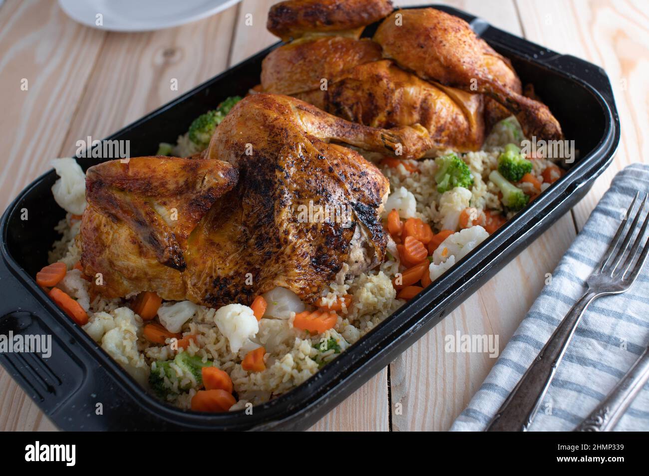Homemade roasted chicken with brown rice and vegetable. Healthy family ...