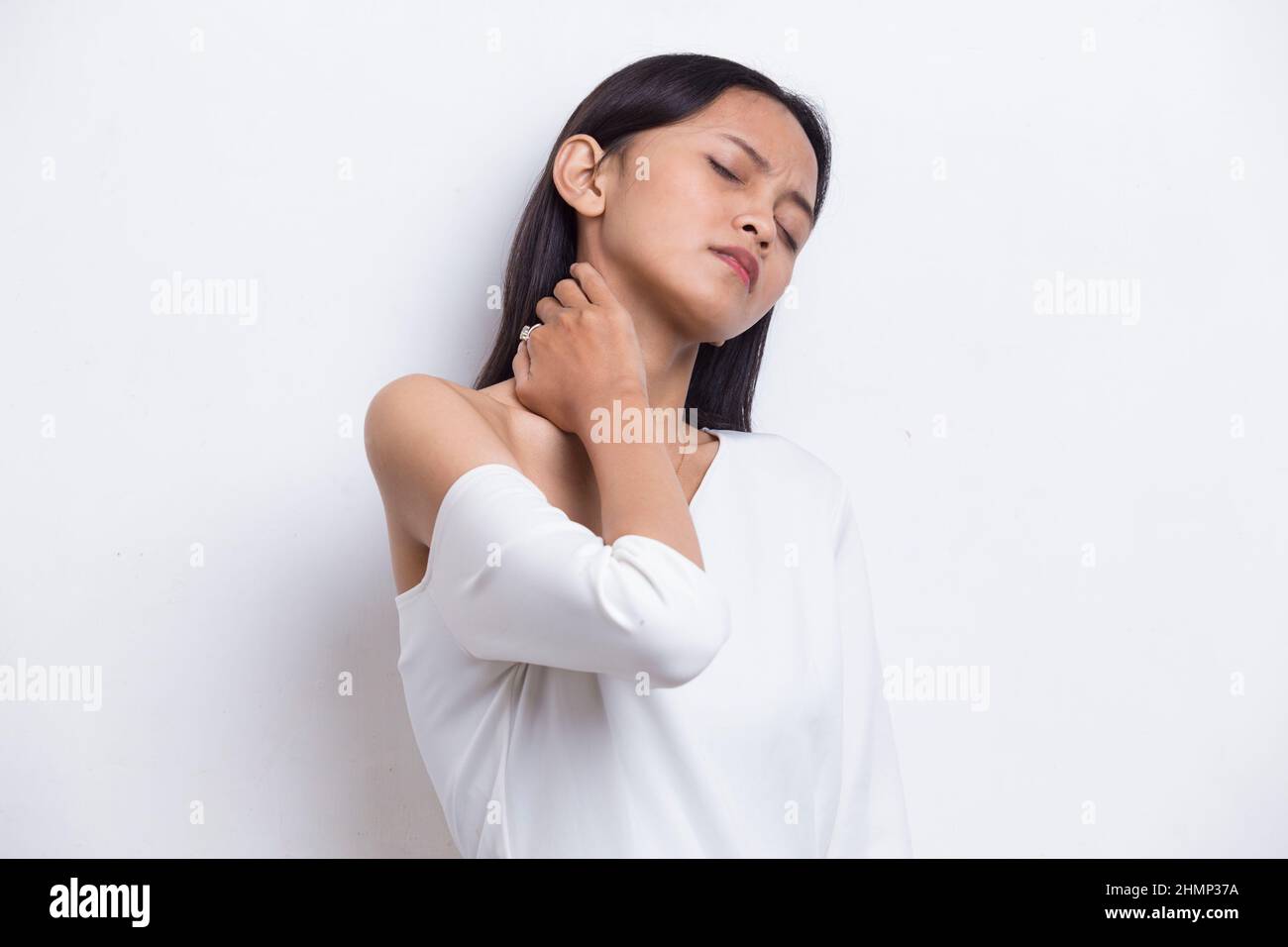 beautiful asian young woman with sore throat neck and shoulder pain ...