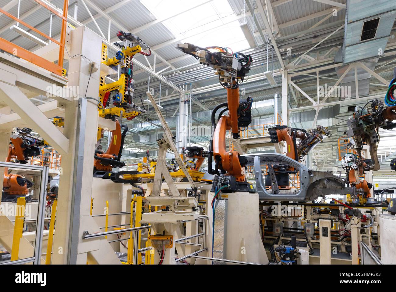 Photo of automobile production line. Welding car body. Modern car ...