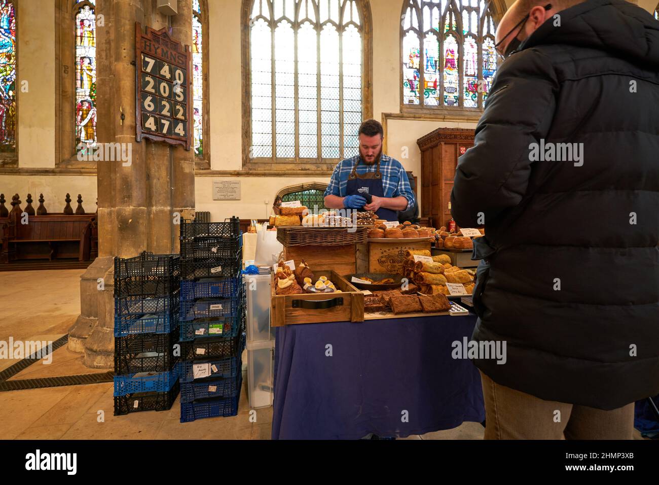 Cake stall at an indoor fair Stock Photo - Alamy