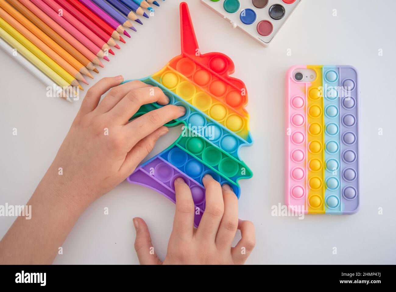 Rainbow colored child toys Stock Photo - Alamy