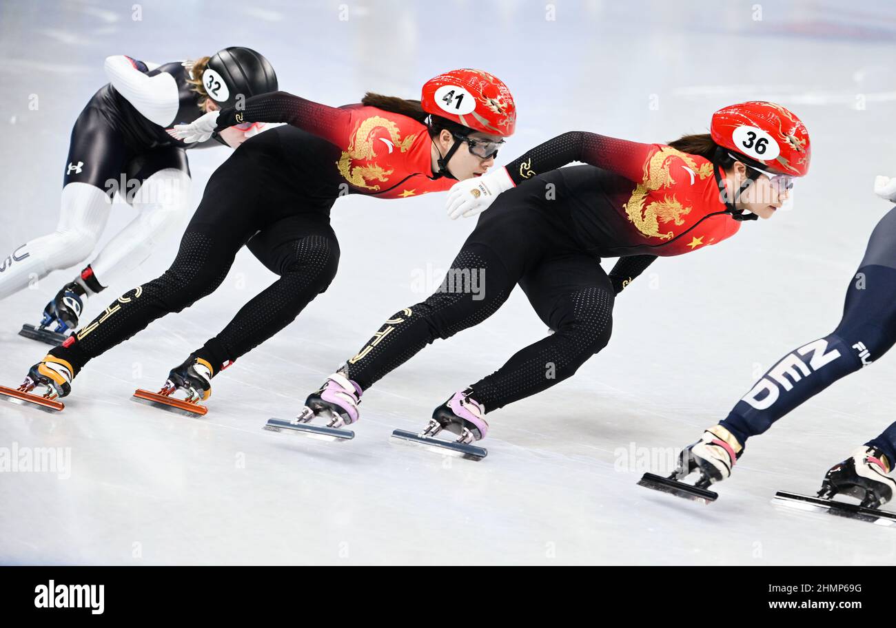 Beijing, China. 11th Feb, 2022. Qu Chunyu (2nd L) and Han Yutong (R) of ...