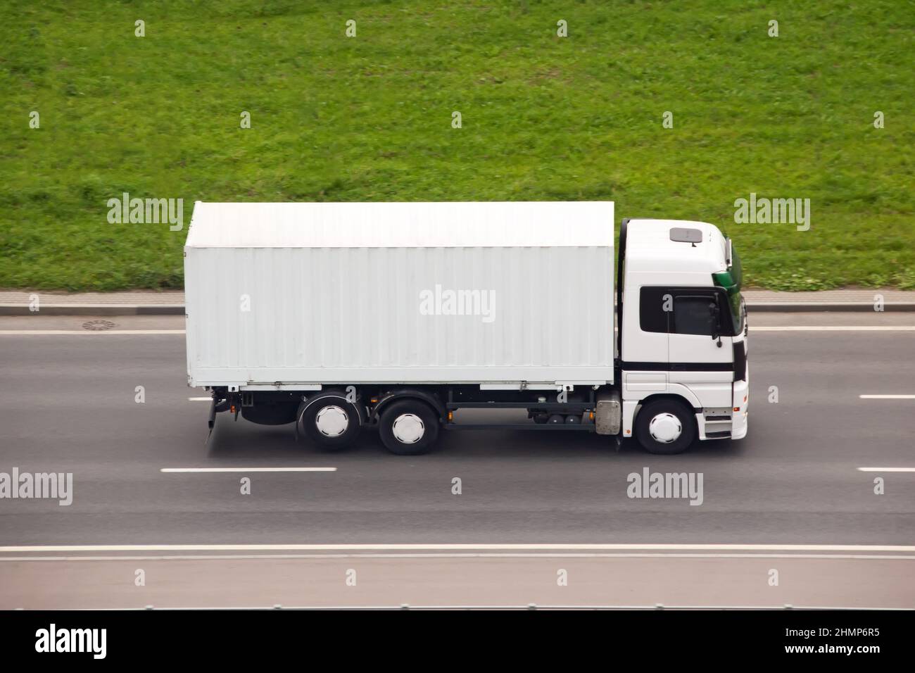 Cargo truck white color go on road Stock Photo - Alamy