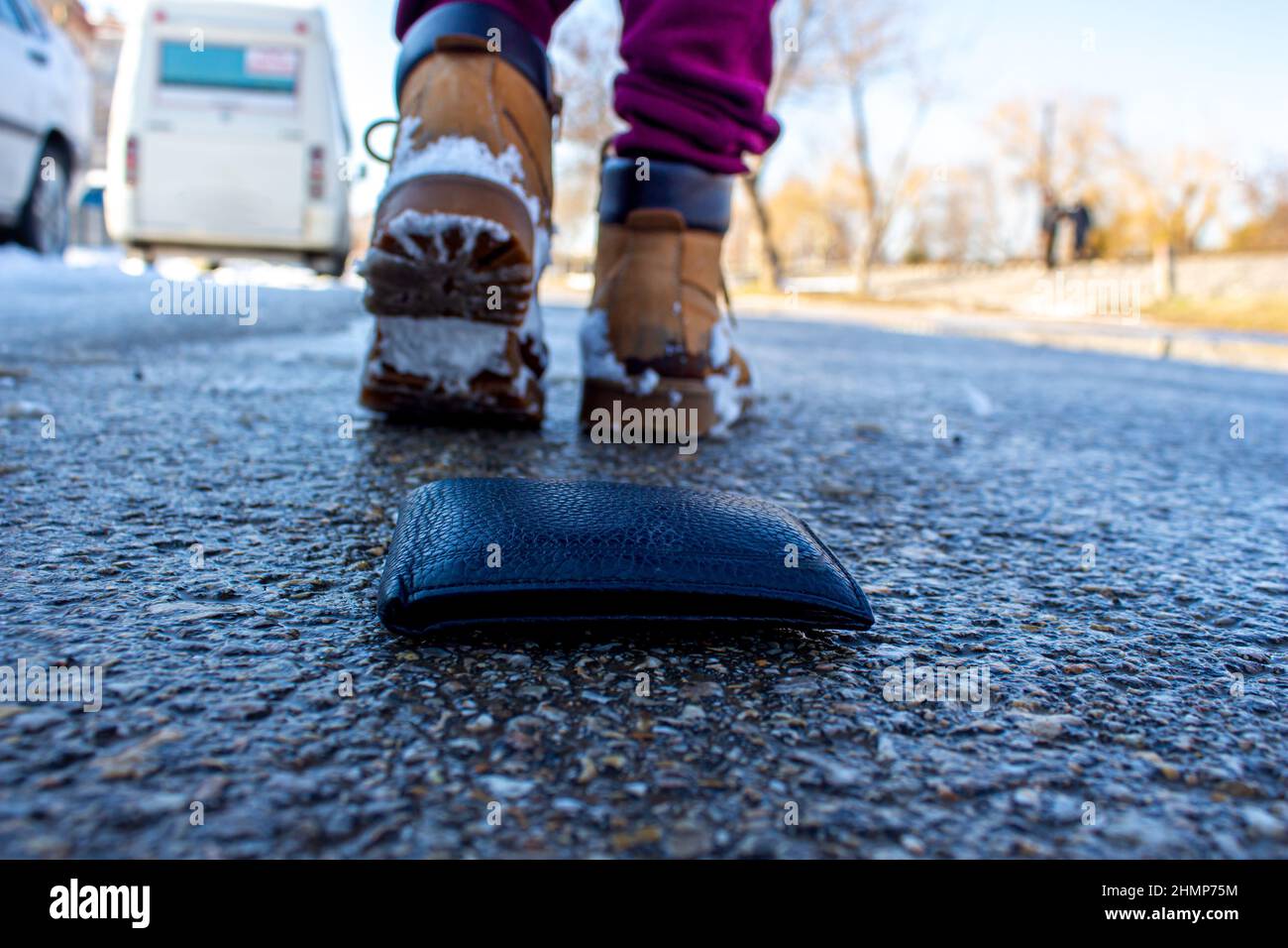 Man dropping his wallet on the road. Concept of losing wallet Stock ...