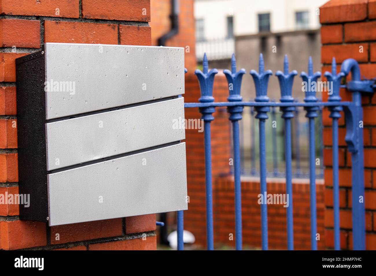 Mailboxes mounted at entry gates, mailboxes embedded in a stone wall ...
