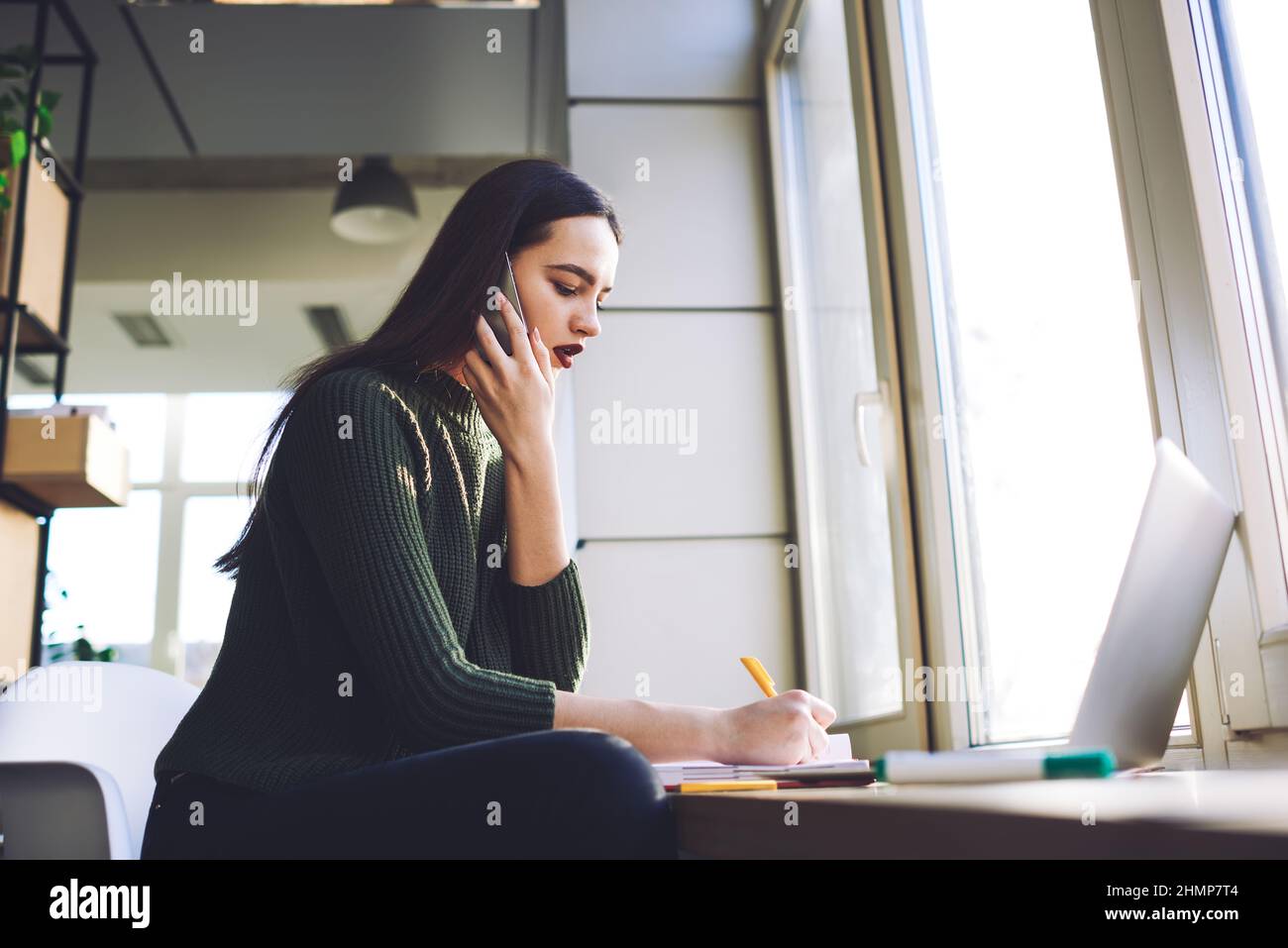 Young woman taking notes during phone call Stock Photo - Alamy Young woman taking notes during phone call Stock Photo - Alamy
