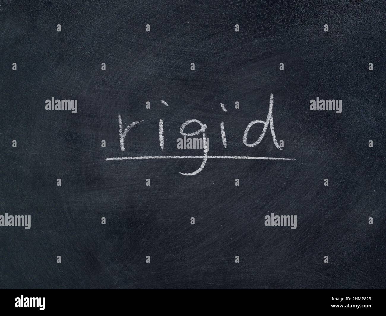 rigid concept word on blackboard background Stock Photo - Alamy