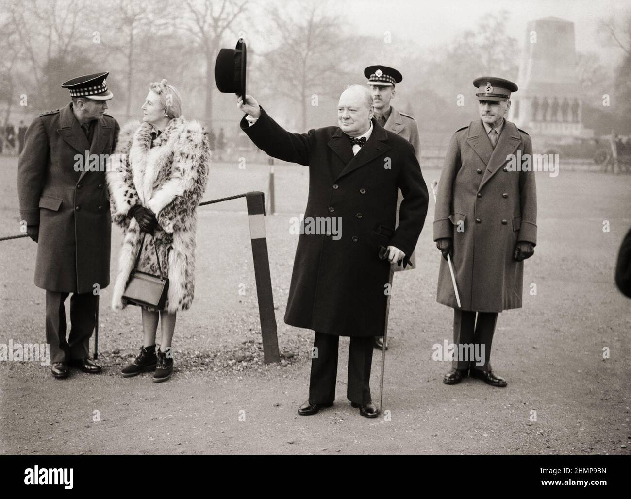 Winston Churchill raises his hat in salute during an inspection of the ...