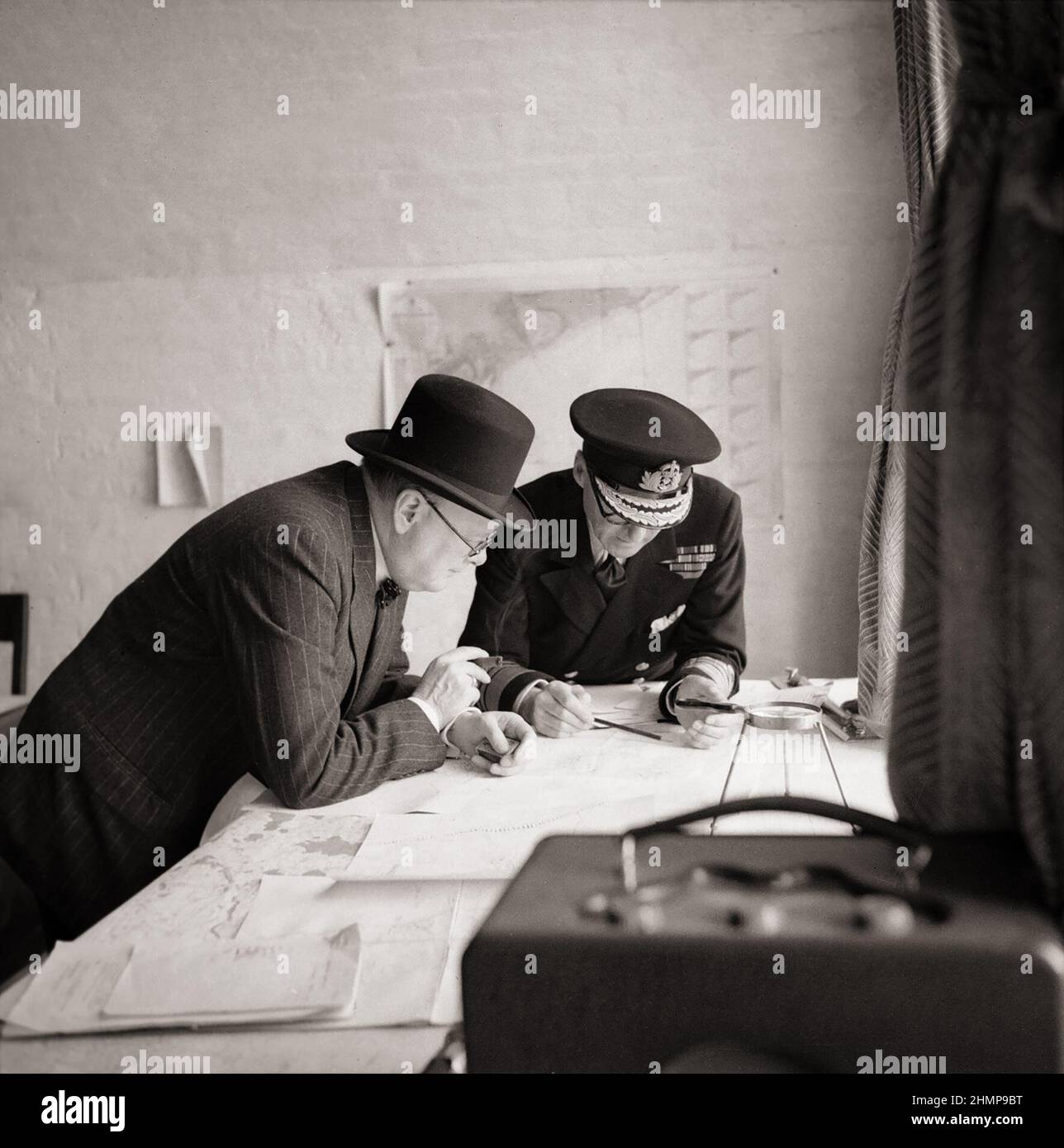 Winston Churchill studies after action reports with Vice Admiral Sir ...